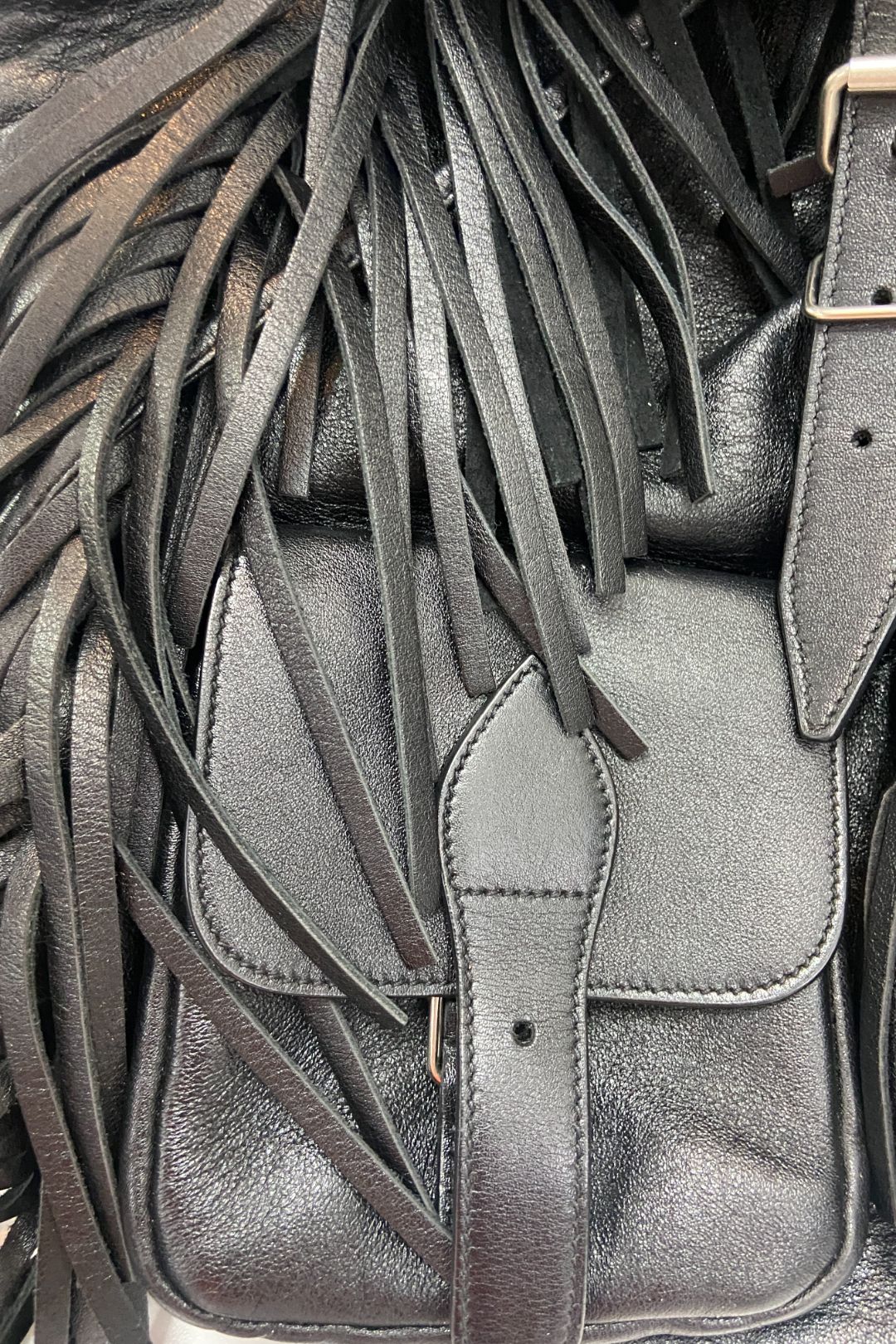 Buy Fringe Leather Backpack in Black | Saint Laurent | GlamCorner